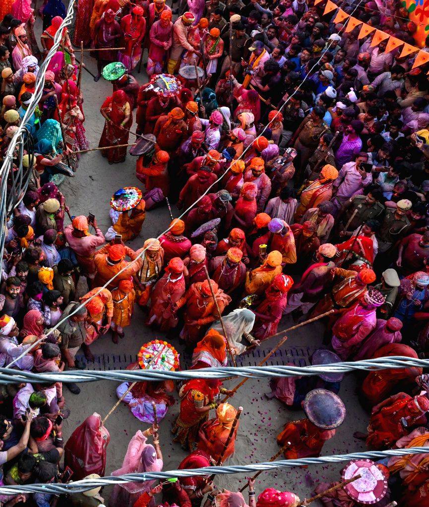Mathura : Devotees celebrate Lathmar Holi at Shri Nand Baba Temple in ...