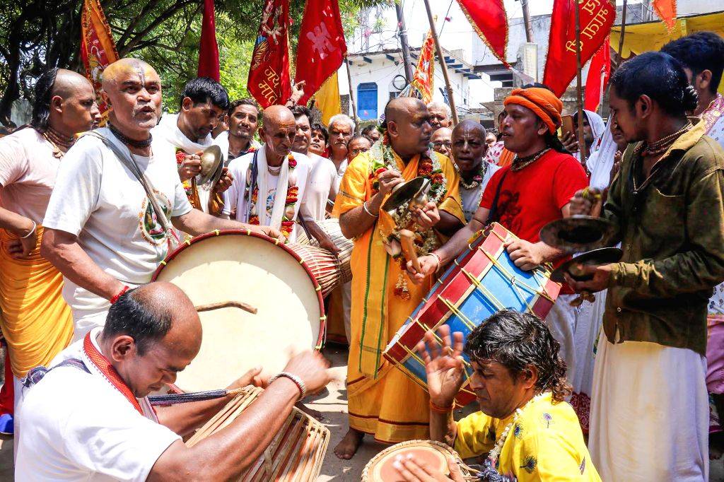 Mathura : Devotees take part in a religious procession on the occasion ...