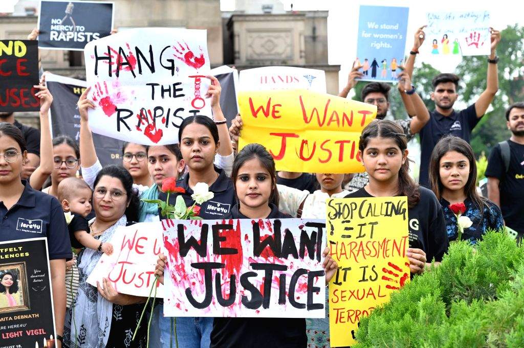 Medical students hold placards during a protest at Statue Circle