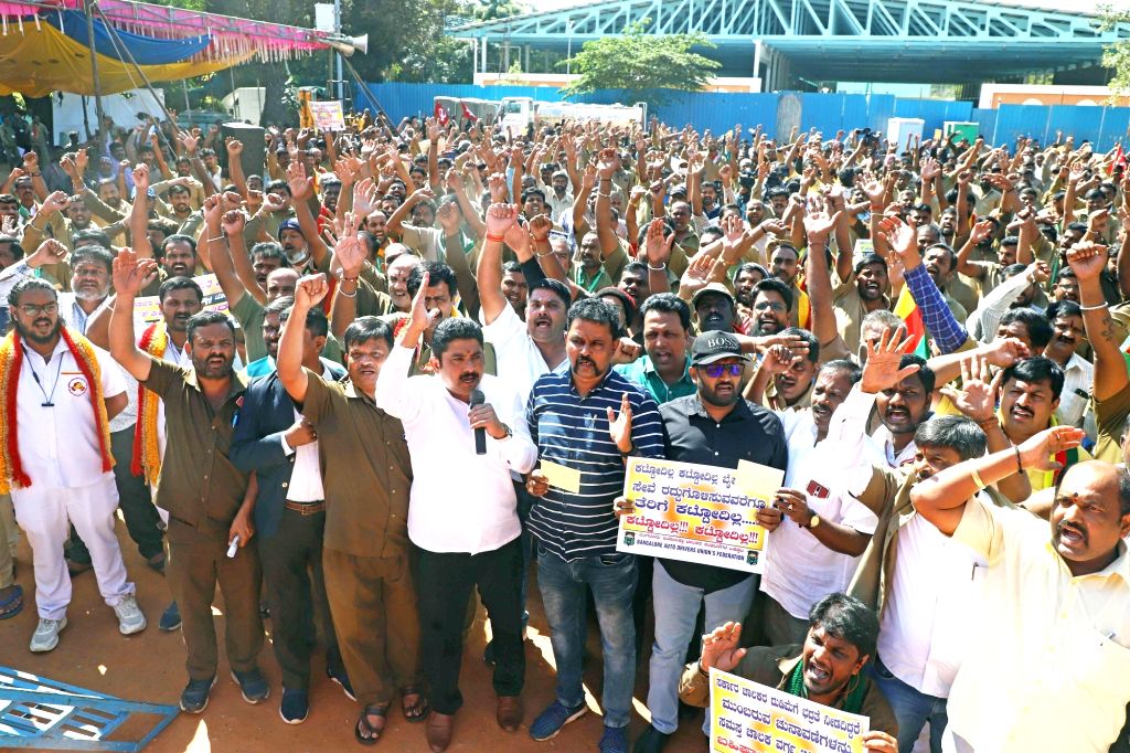 Members of Bangalore Auto Drivers Union's Federation raise slogans ...