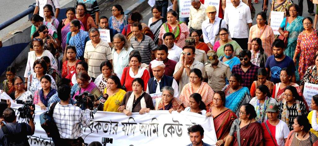 Members of Kamduni Pratibadi Mancha take part in a protest rally