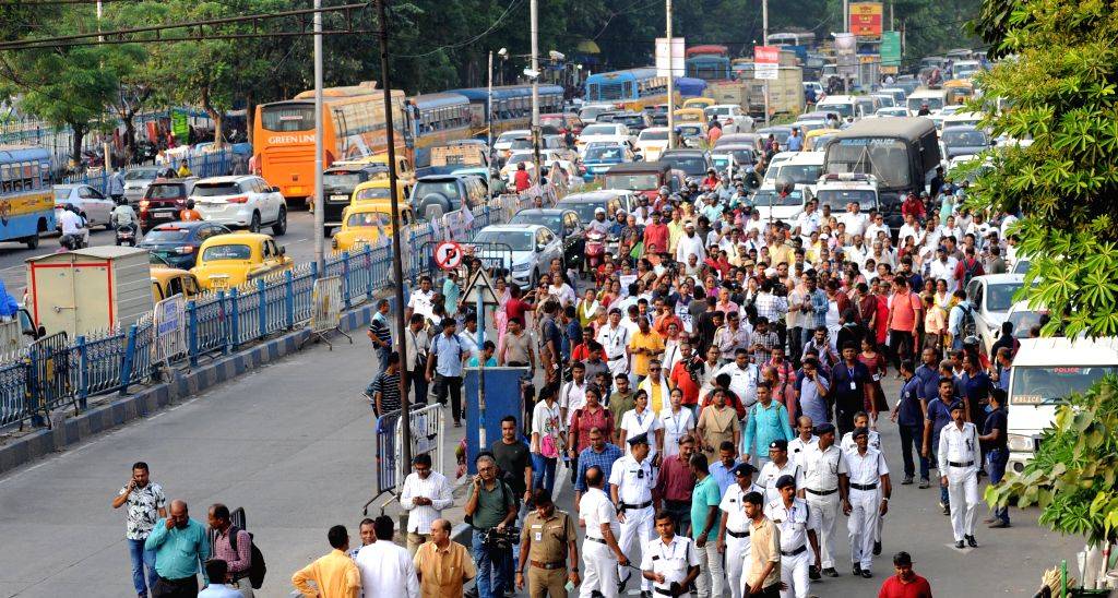 Members of Kamduni Pratibadi Mancha take part in a protest rally