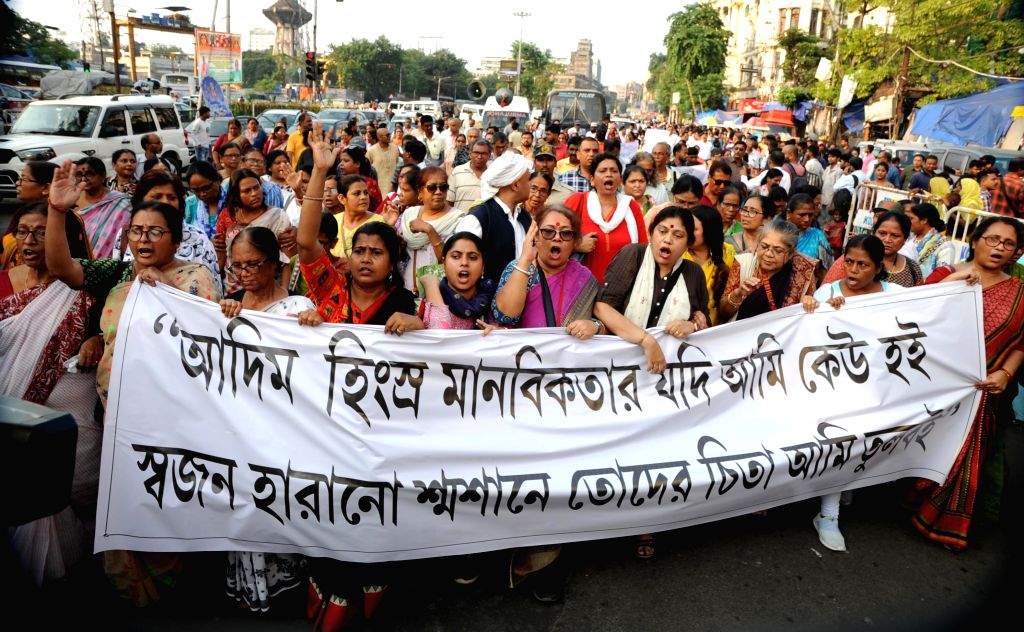 Members of Kamduni Pratibadi Mancha take part in a protest rally