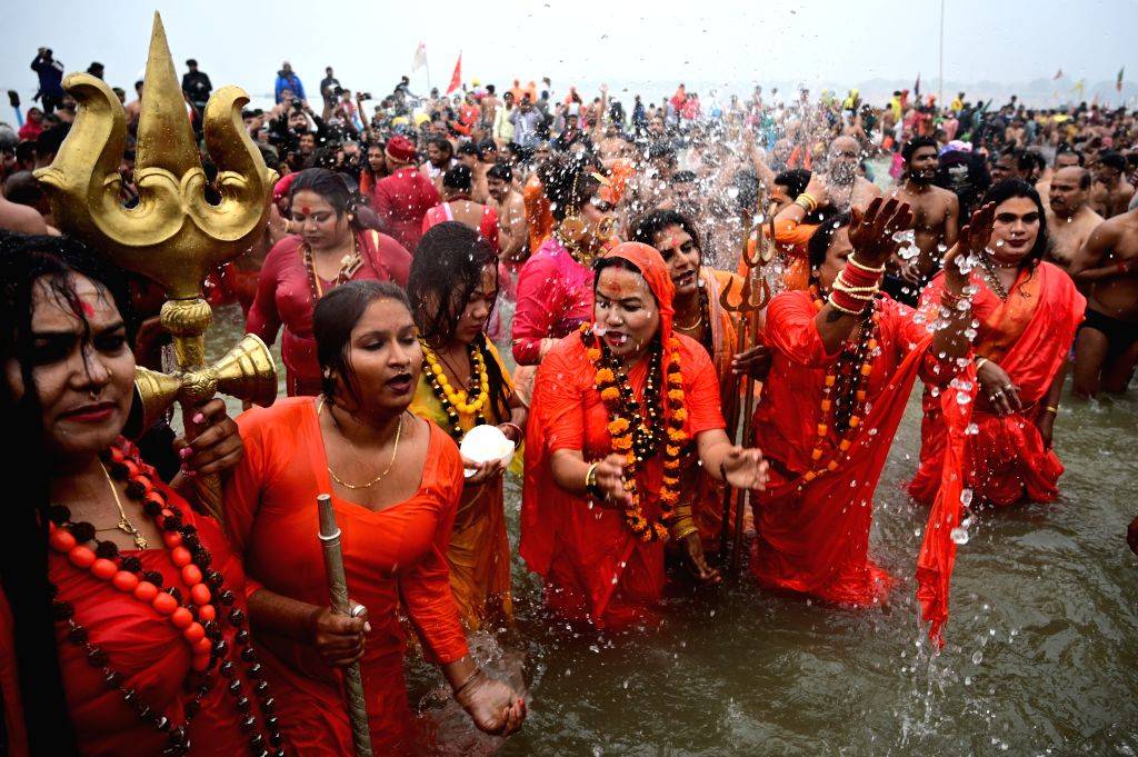 Members of 'Kinnar Akhada' take a holy dip during the 'Amrit Snan