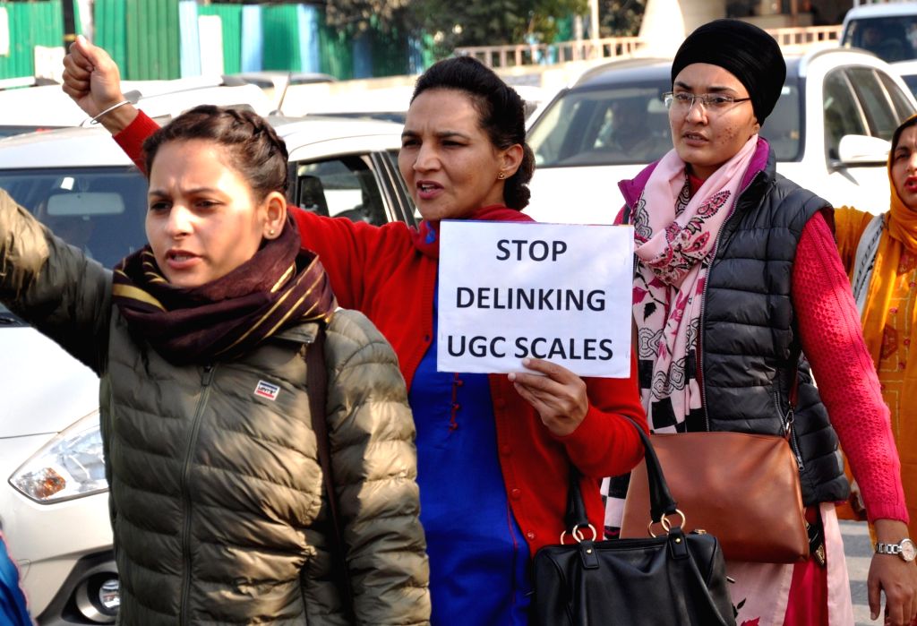 Members of Punjab and Chandigarh College Teachers Union (PCCTU) shout ...