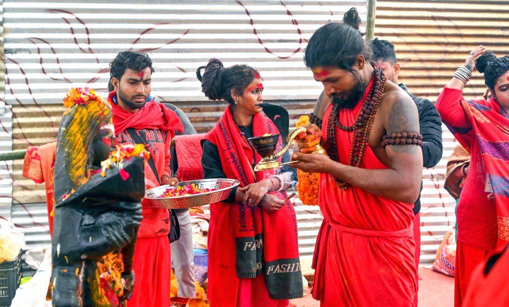 Members of the 'Kinnar Akhada' performs ritual at the Triveni Sangam,
