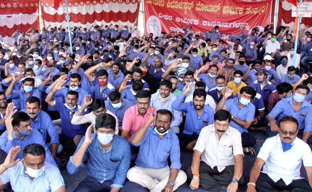 Members of Toyota Kirloskar Motor Workers Association stage a sit-in ...