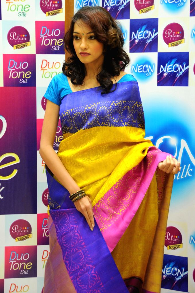 Models showcase sarees at the fashion show