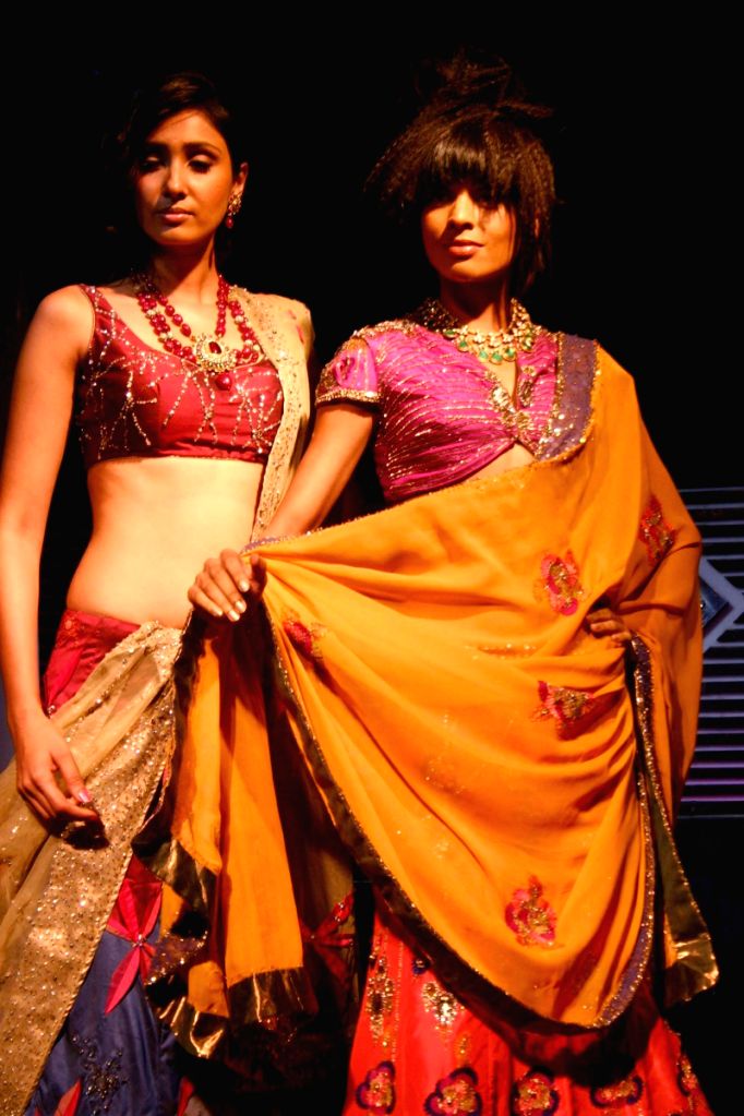 Models with designers Rahul,Gunjan and Payal Gupta at the unveiling of ...