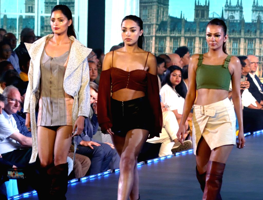 Models walk on a ramp during a fashion show
