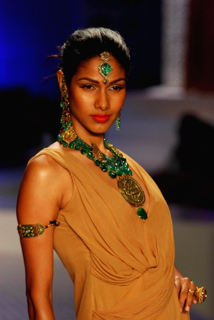 Models walk on the ramp for Queenie Show.