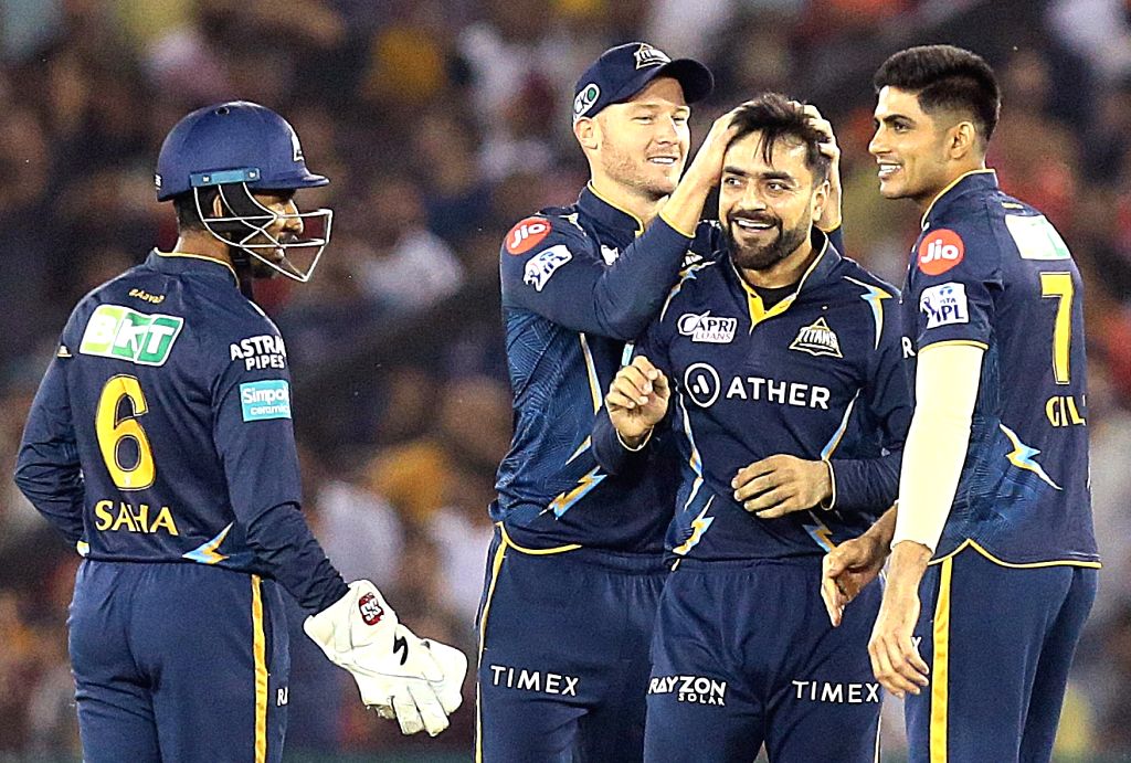 Mohali : GT's Rashid Khan celebrates the dismissal of PBKS' Matt Short