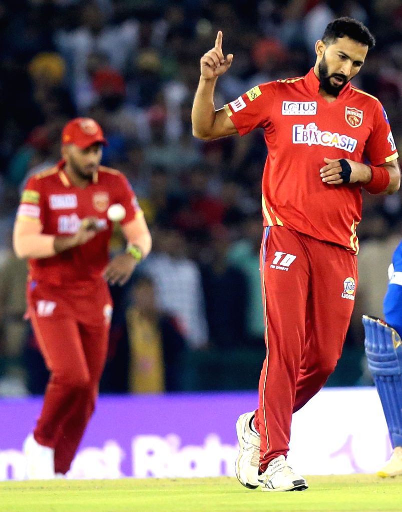 Mohali : PBKS bowler Rishi Dhawan celebrates the dismissal of MI's ...