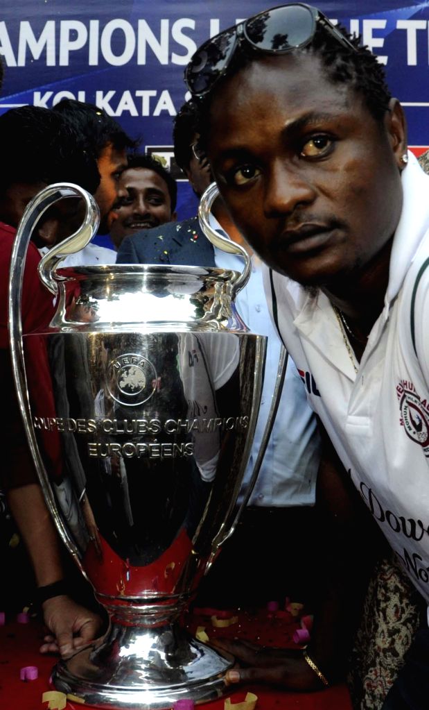 Mohun Bagan footballers look at UEFA Champions League Trophy