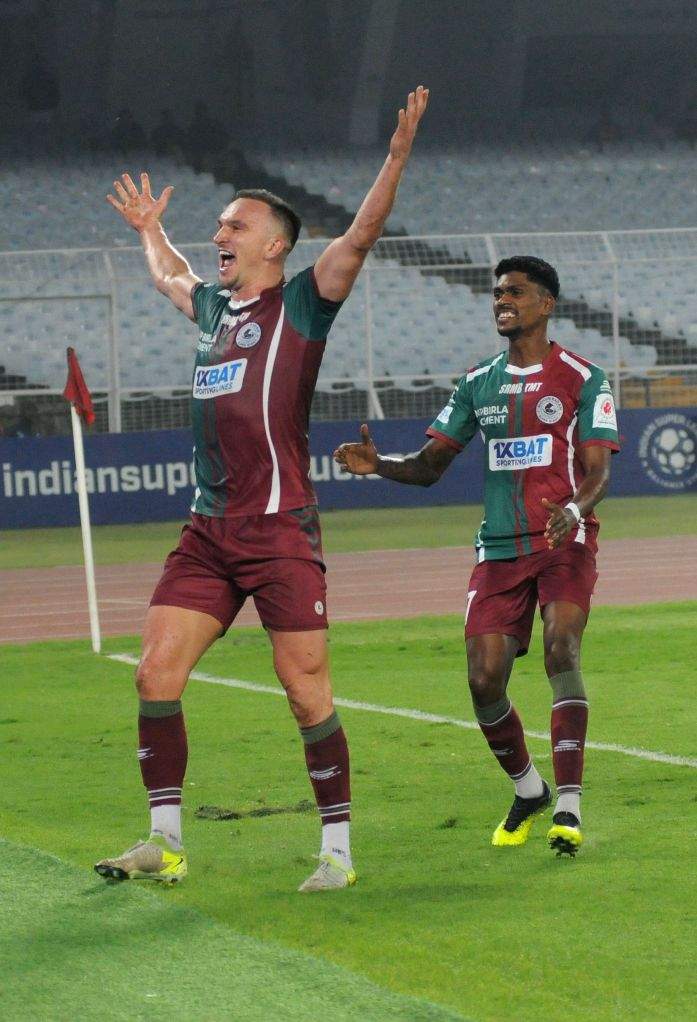 Mohun Bagan Super Giant players celebrate after scoring a goal during ...