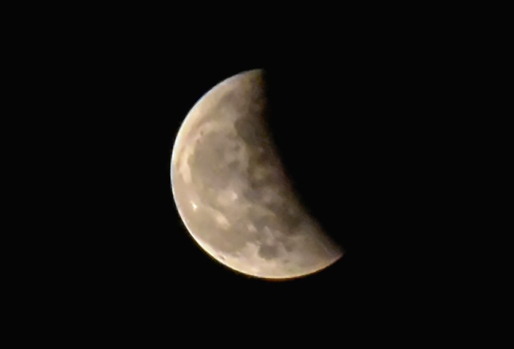 : Balurghat: Moon partially covered by the earth's shadow during lunar ...