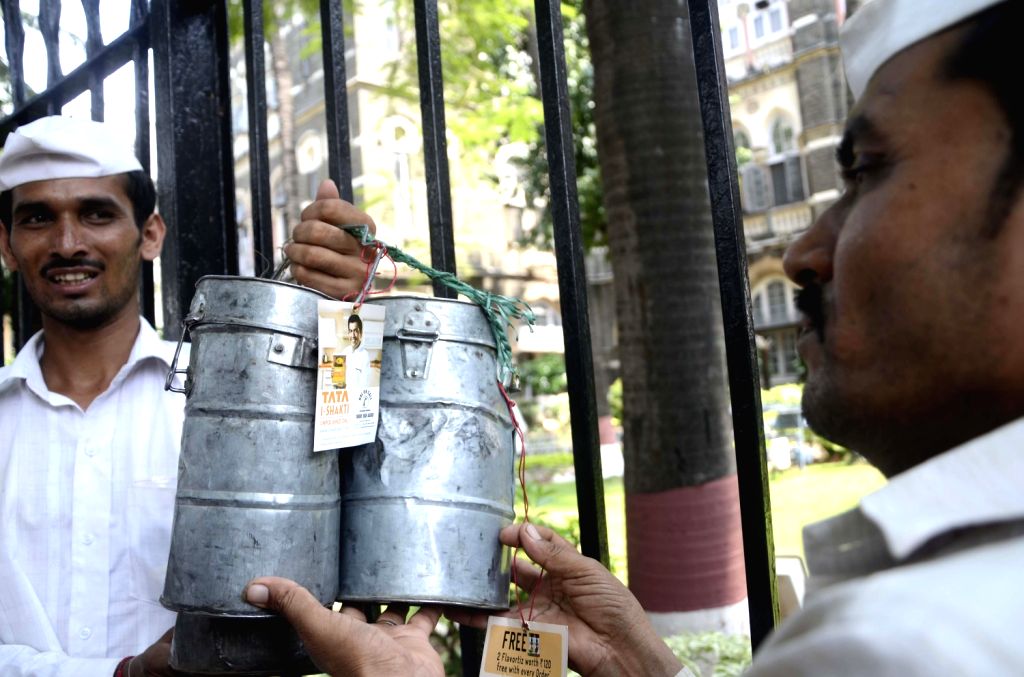 Dabbawalas tag with 'Dal on Call' campaign