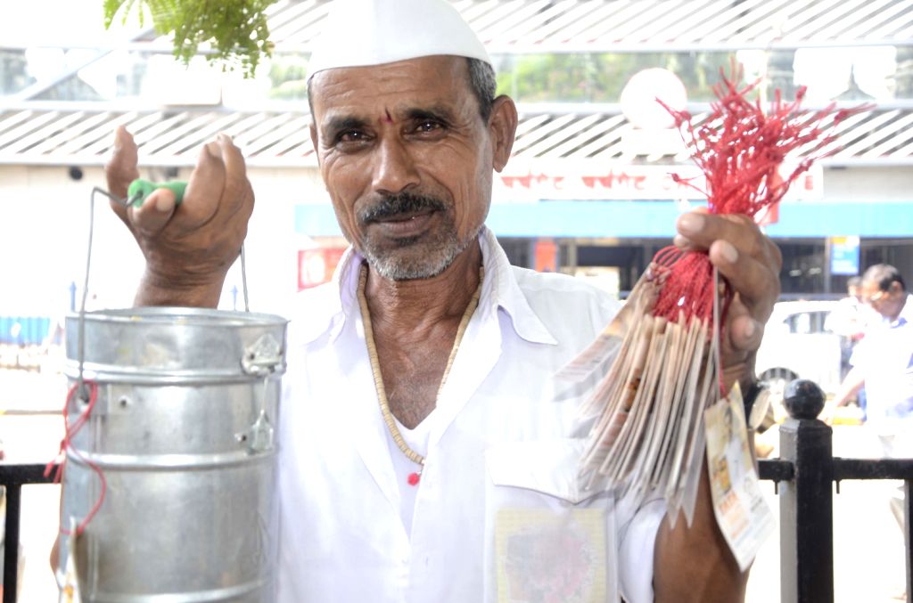 Dabbawalas tag with 'Dal on Call' campaign