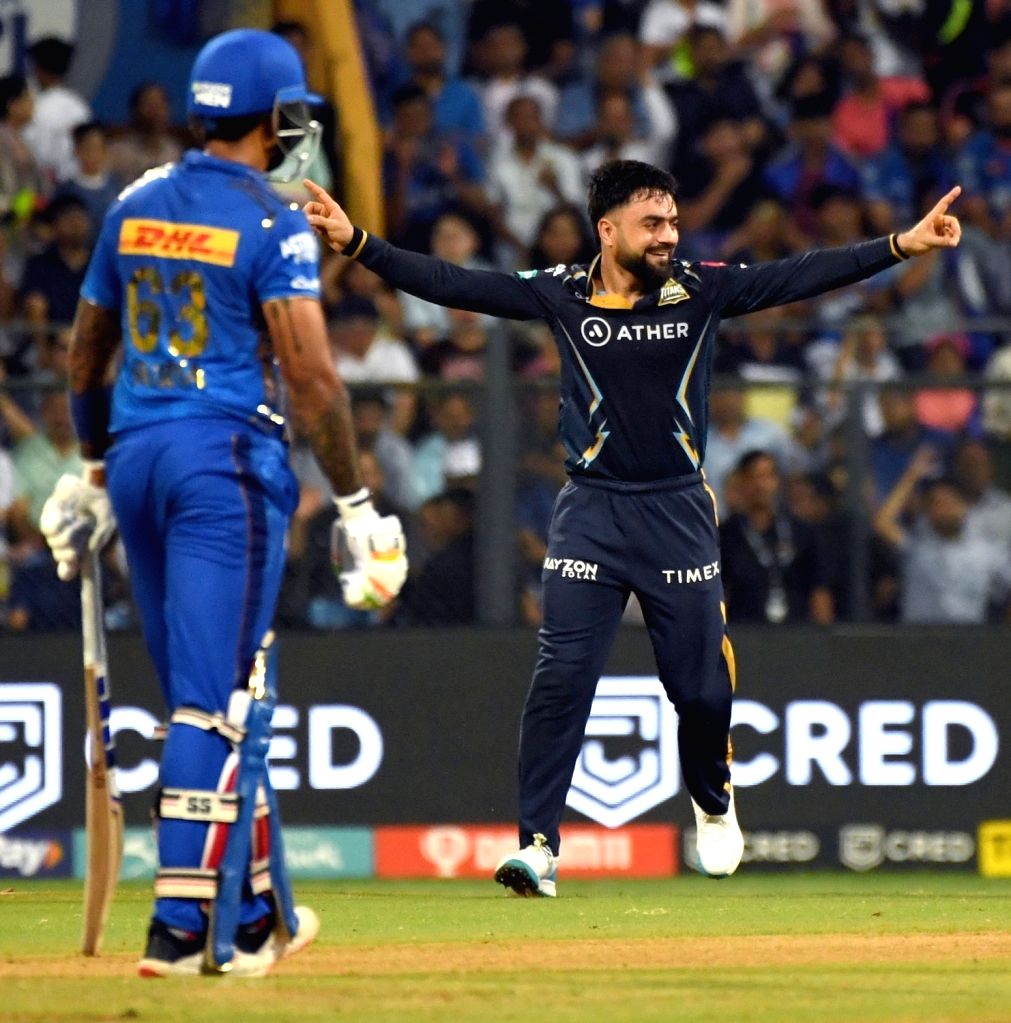 Mumbai : GT's bowler Rashid Khan celebrates the dismissal of MI's Ishan ...