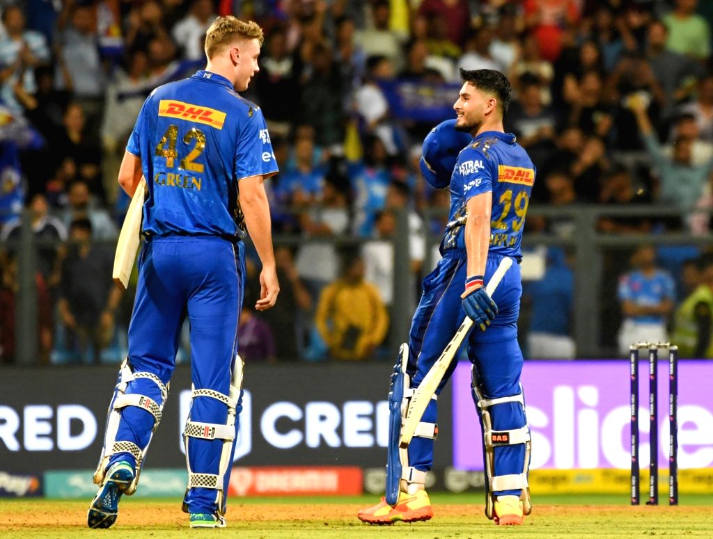 Mumbai : Mumbai Indians' Nehal Wadhera and Cameron Green congratulate ...