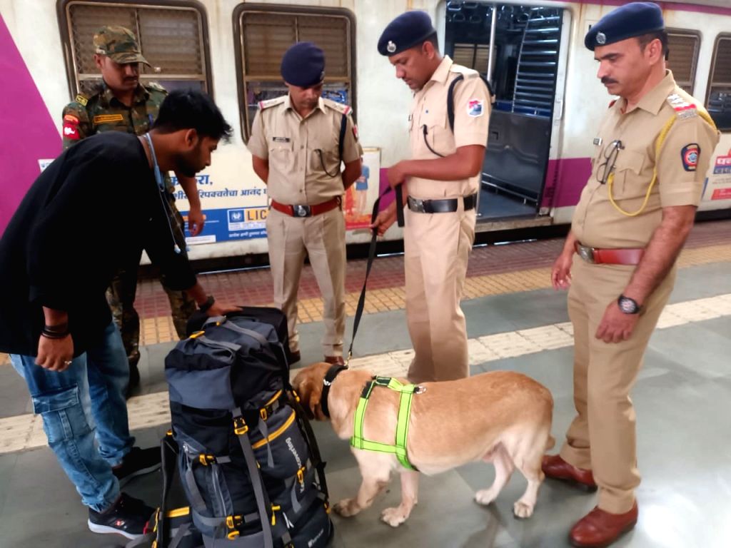 : Mumbai : Security personnel with sniffer dog checks the luggages of ...
