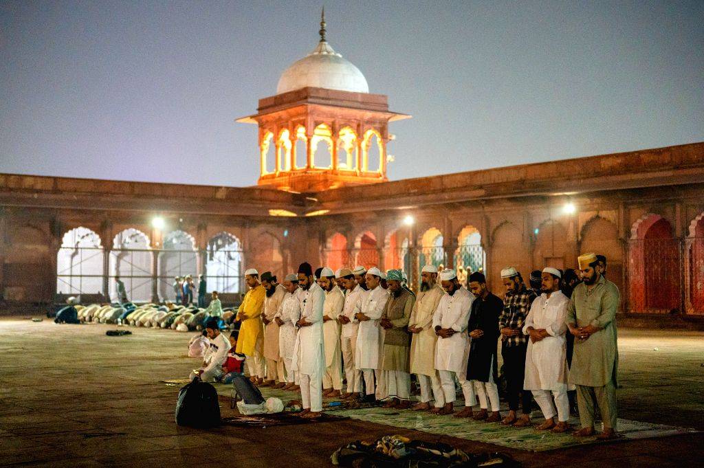 Muslim devotees offer Tarawih prayers to mark the start of the holy ...