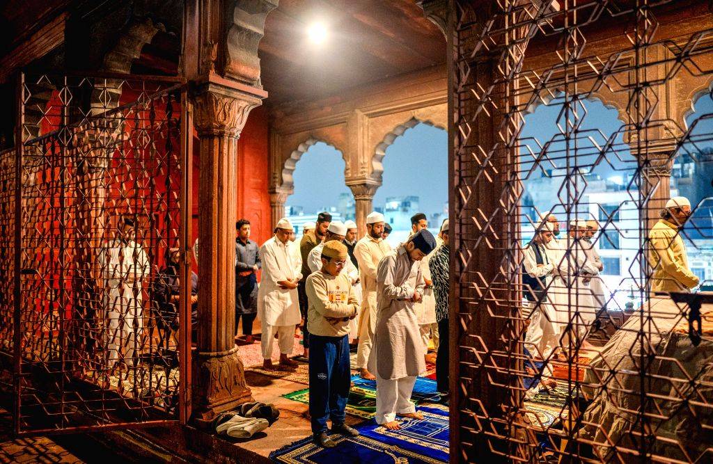 Muslim devotees offer "Tarawih" prayers to mark the start of the holy ...