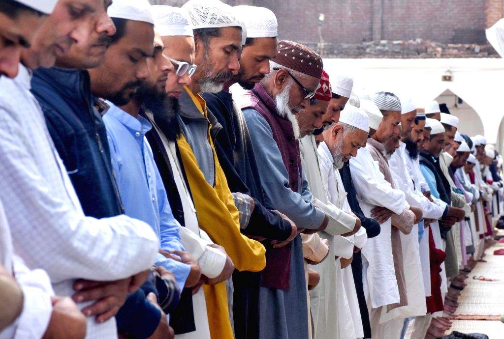 Muslim devotees offer the first Friday namaz during the holy month of ...