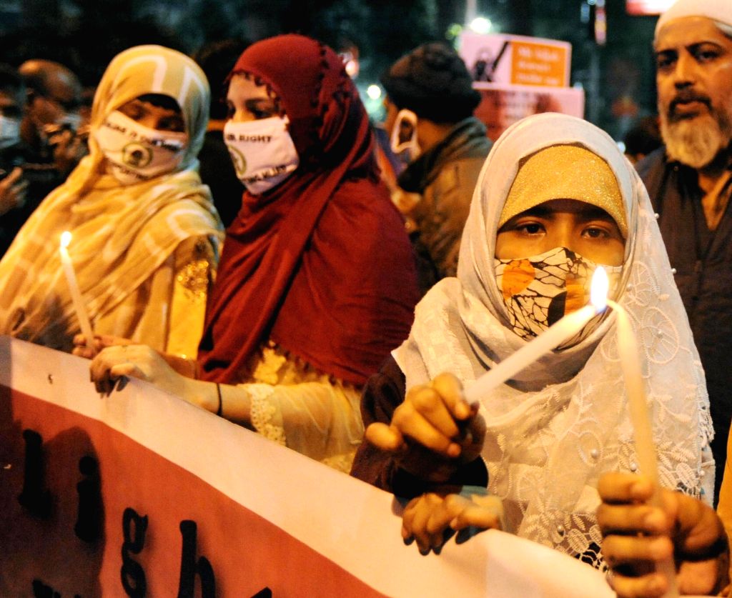 Kolkata :Muslim women lighting candles during a protest march against ...