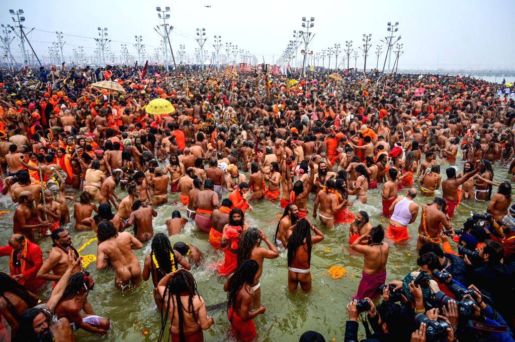 Naga Sadhus (Holy Men) take a holy dip at the Triveni Sangam