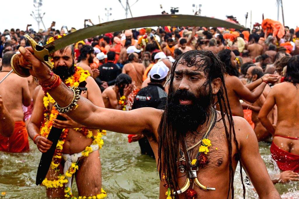 Naga Sadhus (Holy Men) take a holy dip at the Triveni Sangam