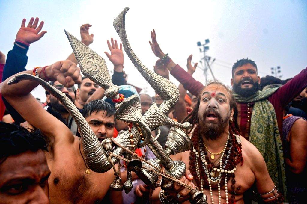 Naga Sadhus (Holy Men) take a holy dip at the Triveni Sangam