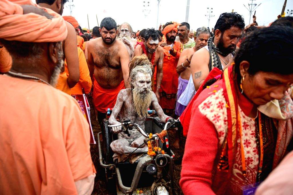 Naga Sadhus (Holy Men) take a holy dip at the Triveni Sangam