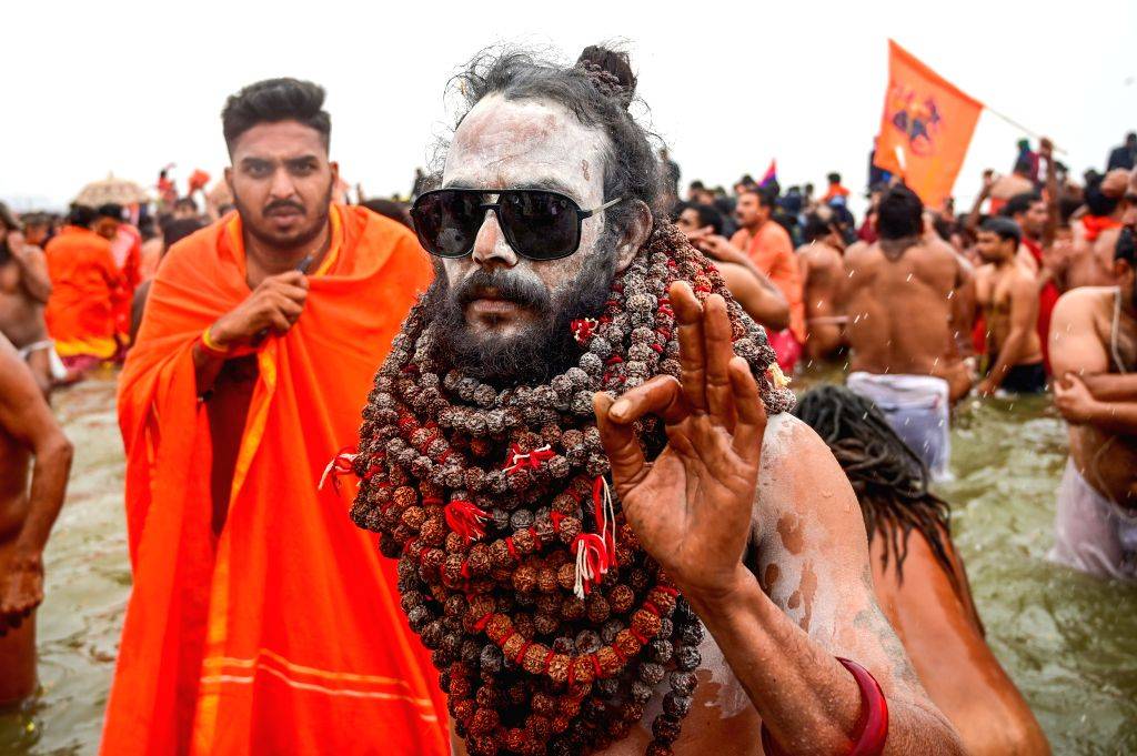 Naga Sadhus (Holy Men) take a holy dip at the Triveni Sangam
