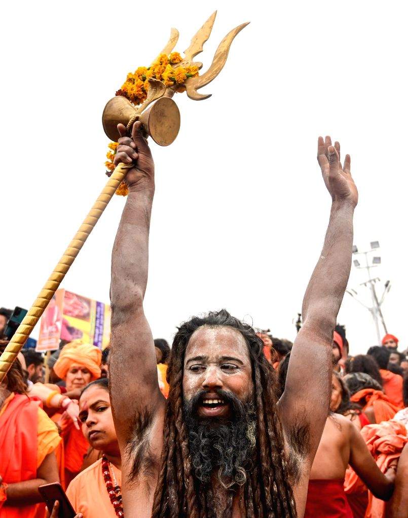 Naga Sadhus (Holy Men) take a holy dip at the Triveni Sangam