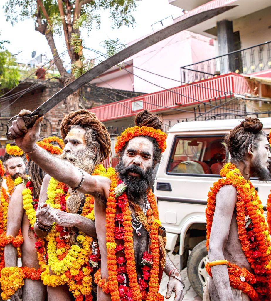 Naga Sadhus of Mahanirvani Akhada take part in a religious procession