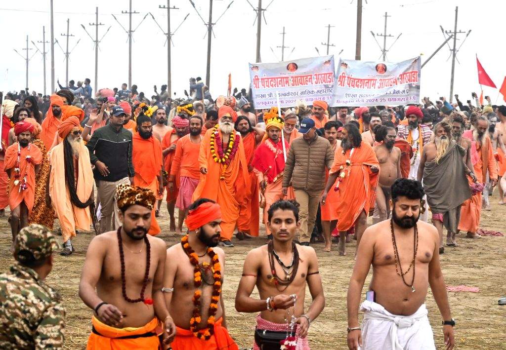 Naga Sadhus proceed towards Sangam Ghat for the 'Amrit Snan