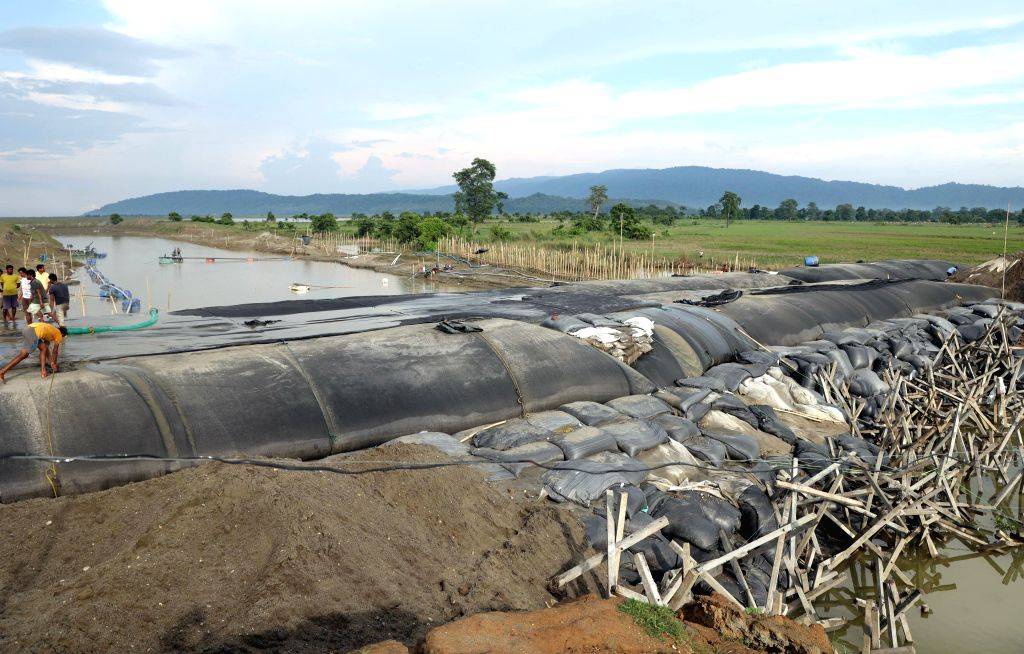 Nagaon : A view of the Hatimura embankment breached near the Kolong ...