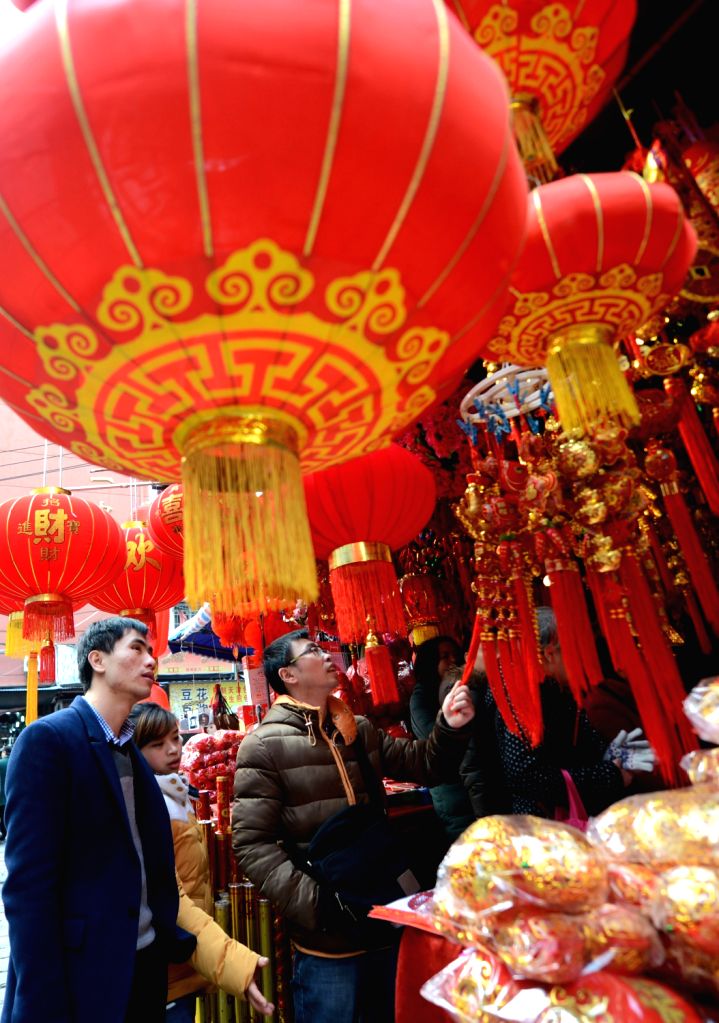 A consumer selects New Year decorations at a shopping mall in Nanchang