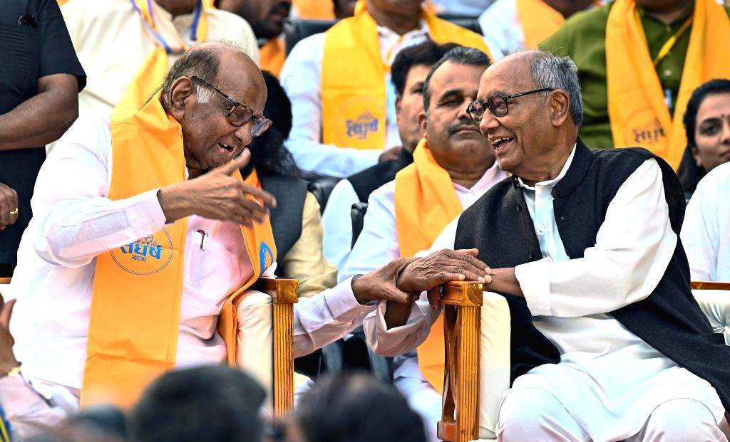 Nationalist Congress Party (NCP) chief Sharad Pawar with Congress MP ...