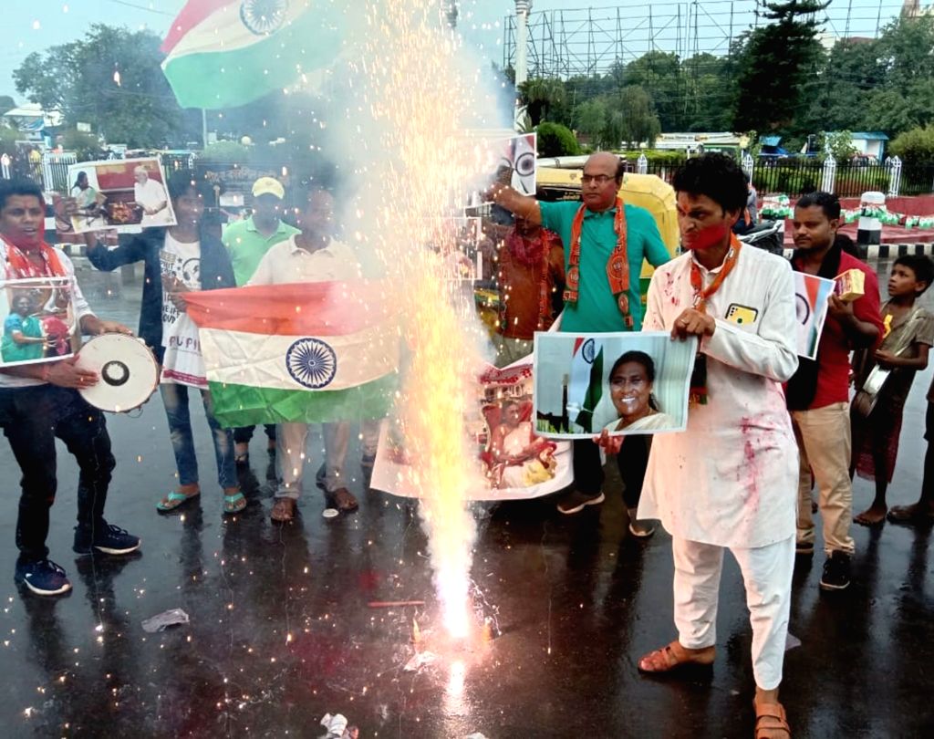 NDA's supporters celebrates in anticipation of the results of ...