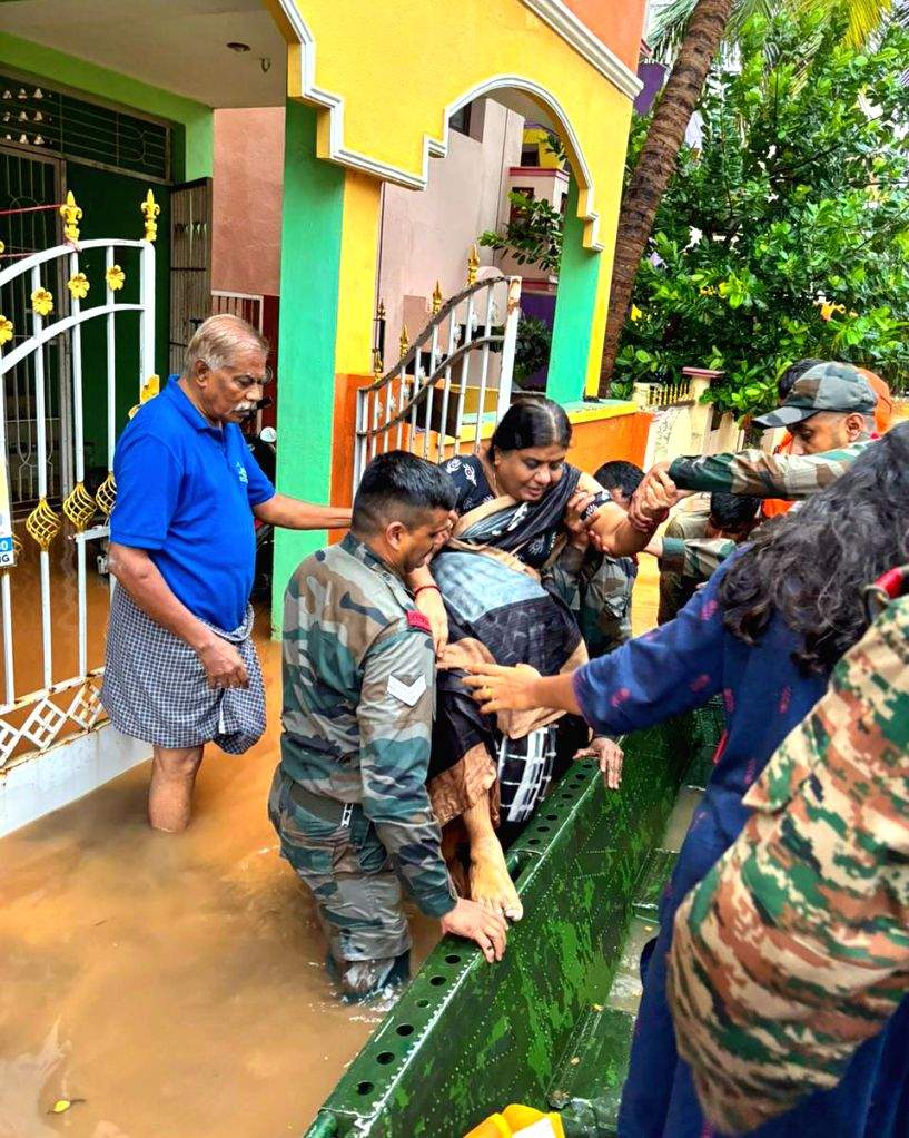 (NDRF) personnel carry out rescue operations amid heavy rain following ...