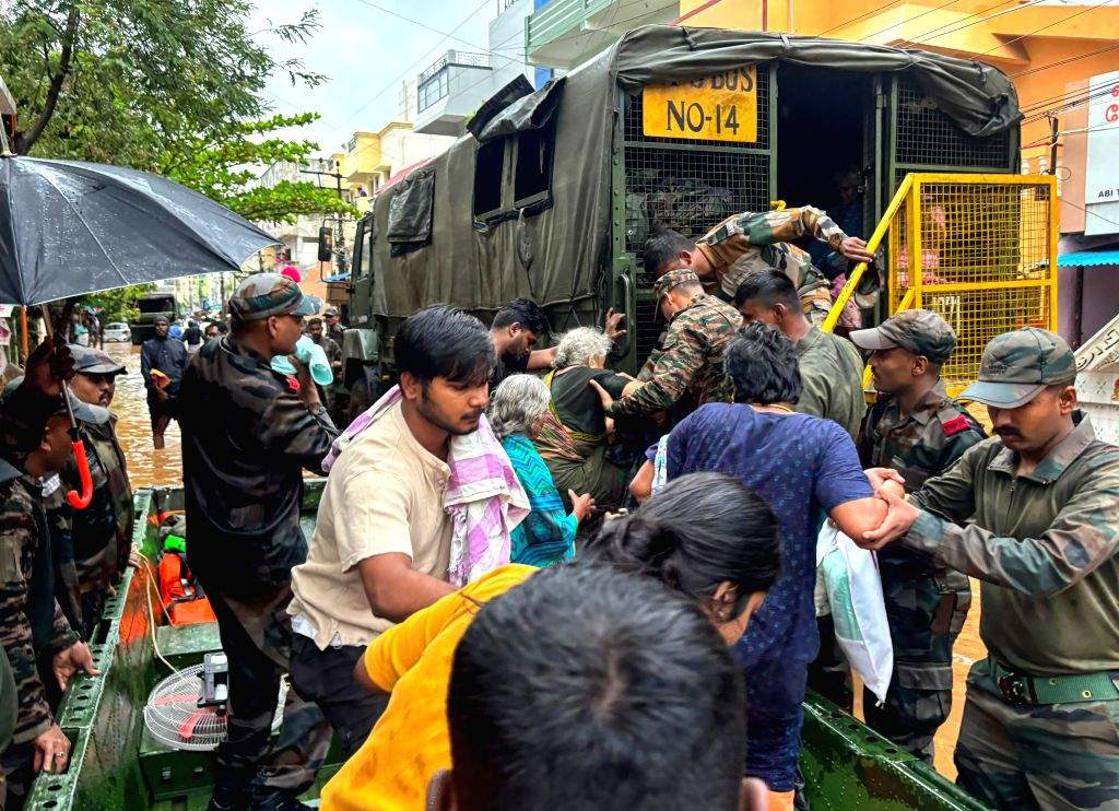 (NDRF) personnel carry out rescue operations amid heavy rain following ...