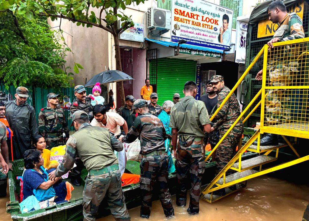 (NDRF) personnel carry out rescue operations amid heavy rain following ...
