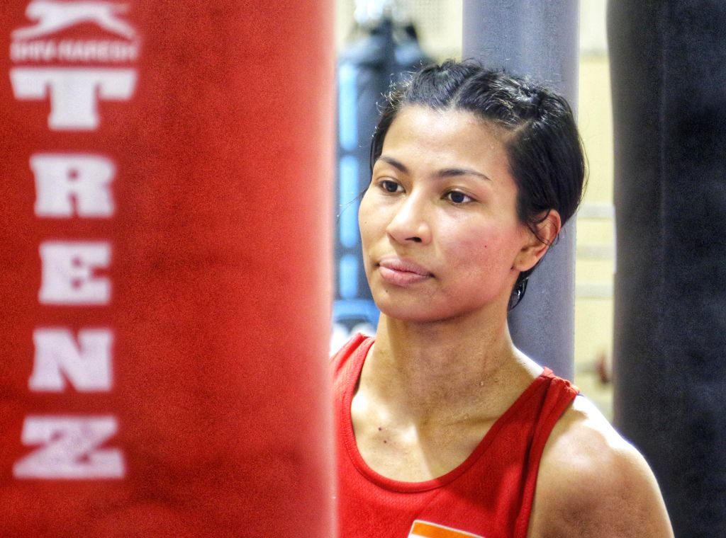 New Delhi:Boxer Lovlina Borgohain(Red) during qualification for the ...