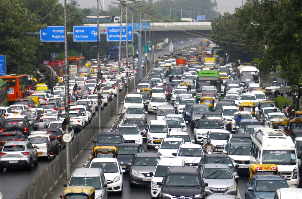 New Delhi : Cars and Buses stuck in traffic jam at ITO