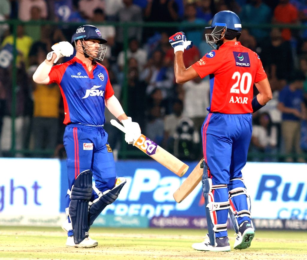 DC batsman Axar Patel celebrates his half-century with team captain ...