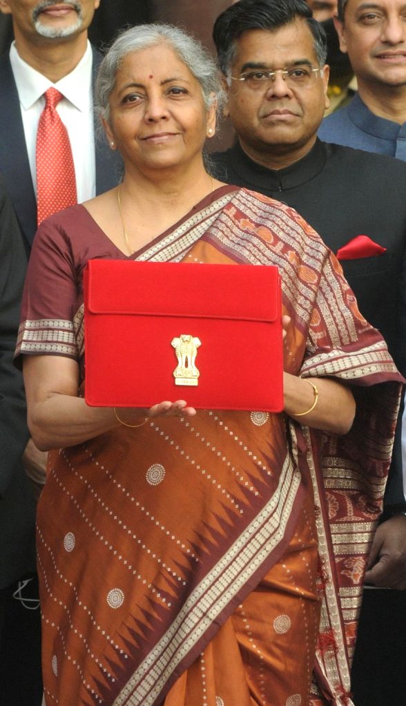 :New Delhi:Finance Minister Nirmala Sitharaman, center, shows annual ...