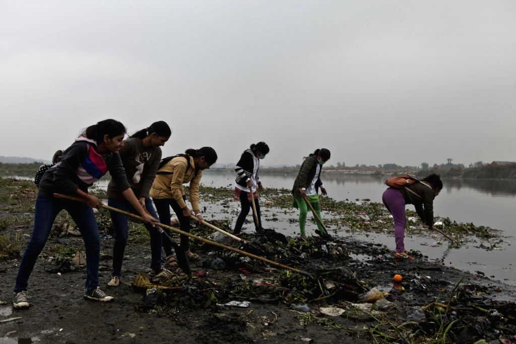 Youth participate in the clean-up prgramme of the Yamuna river