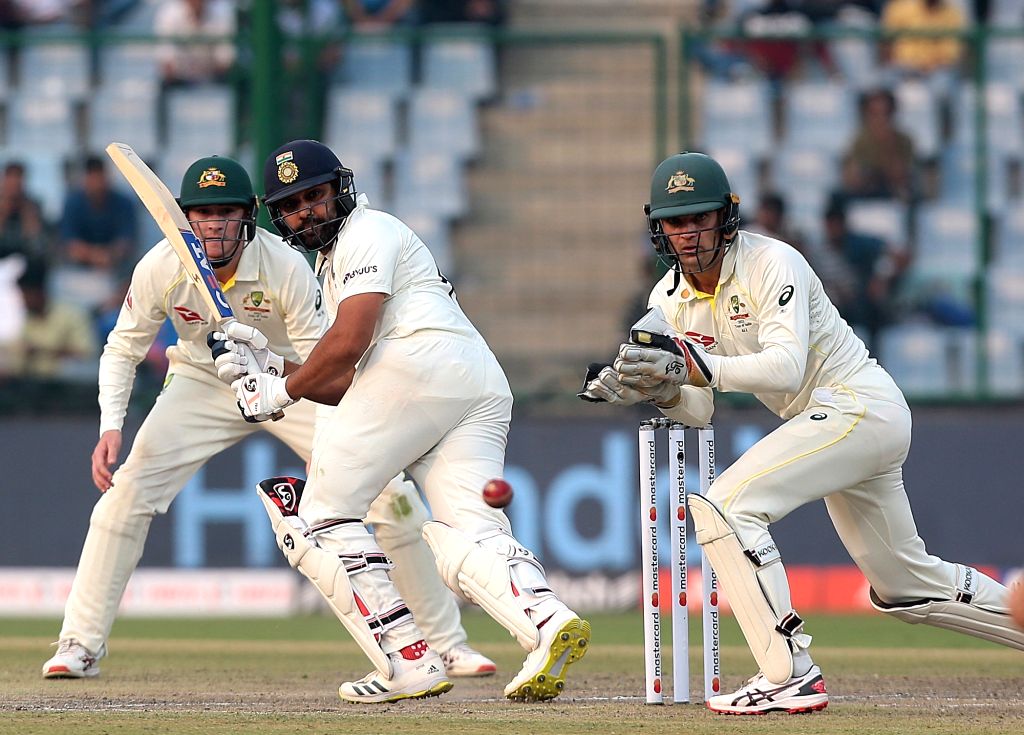 :New Delhi: Rohit Sharma plays a shot during the first day of the ...